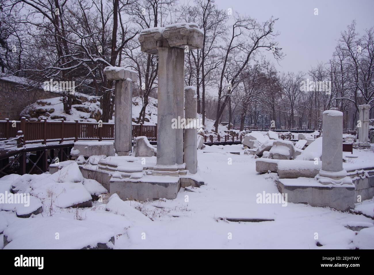 The snow covers debris of the Old Summer Palace, known in Chinese as ...