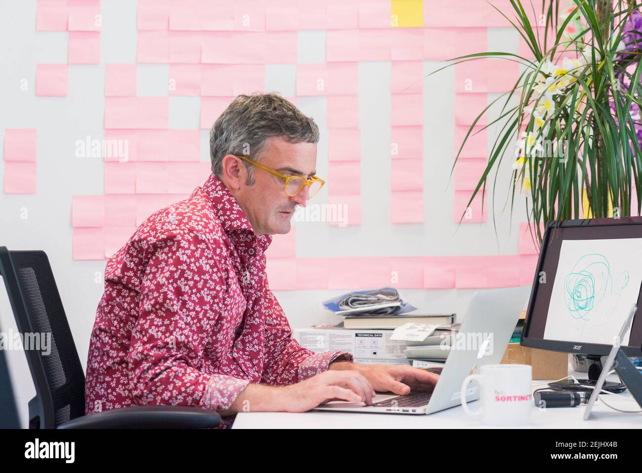 People sat at the work desk in an office and working Stock Photo - Alamy