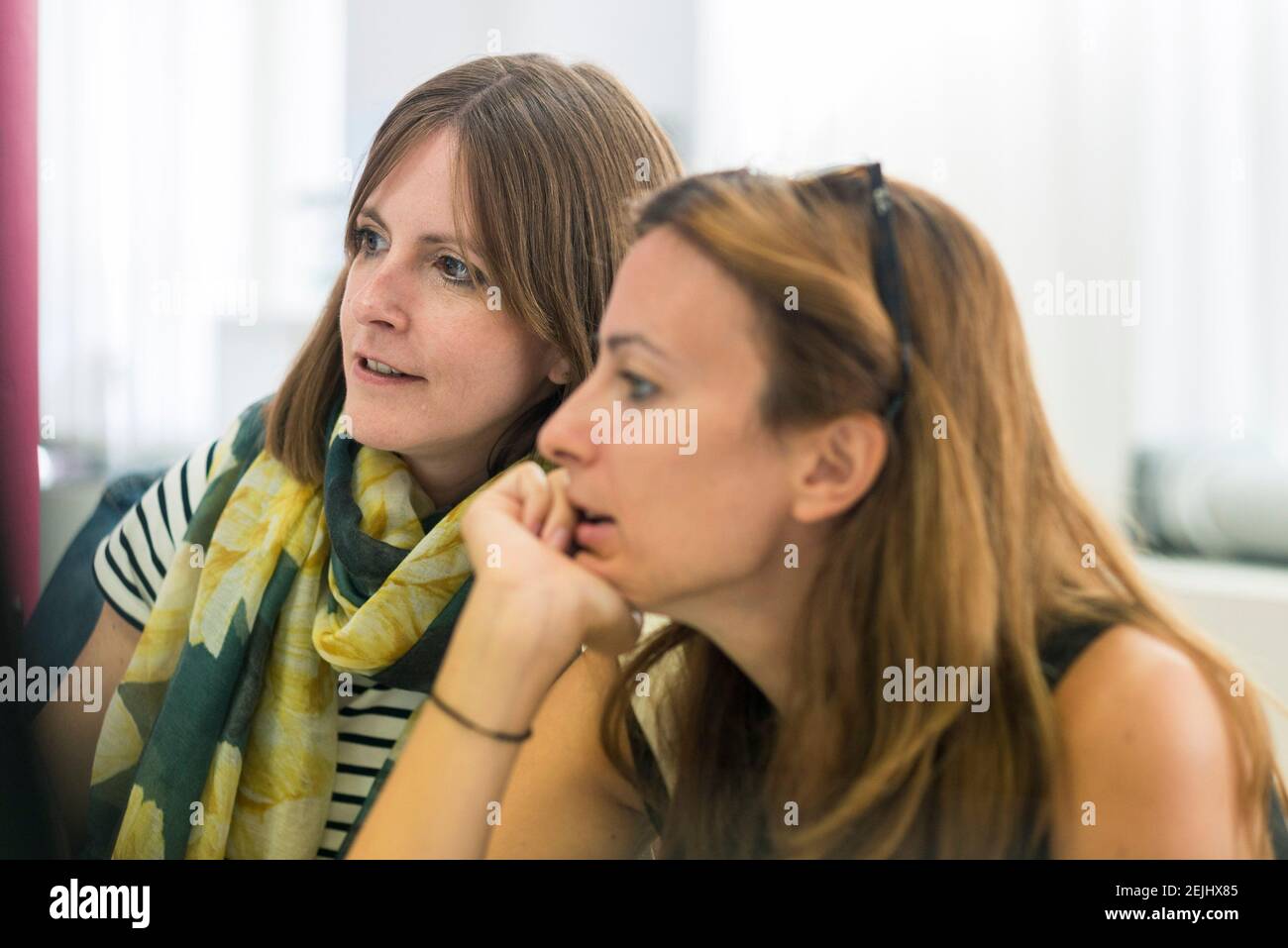 People sat at the work desk in an office and working Stock Photo - Alamy