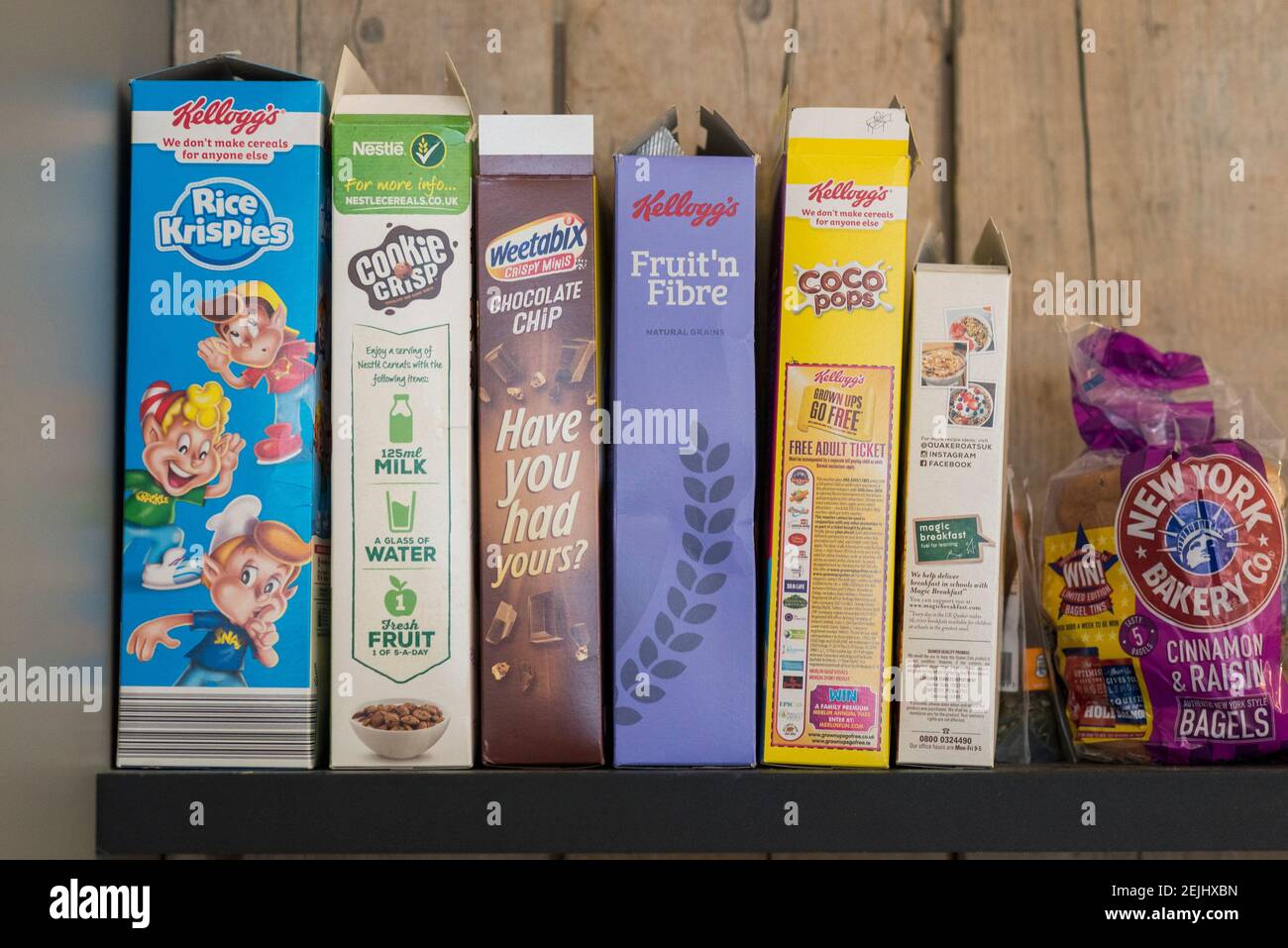 A row of cereal boxes lined up on a shelf in a modern office Stock ...