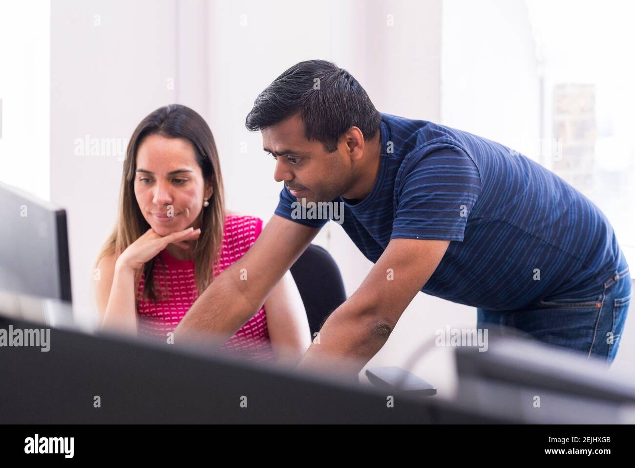 People sat at the work desk in an office and working Stock Photo - Alamy