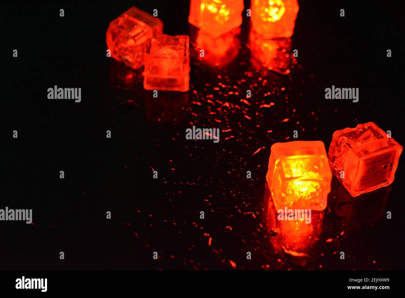 Very bright and not ordinary background of red glowing ice cubes ...