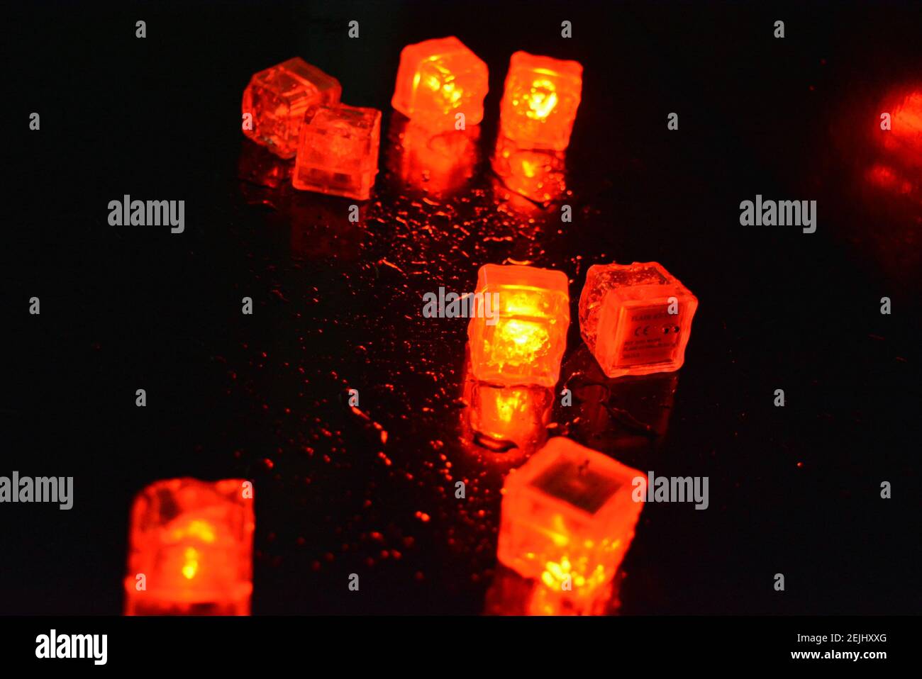 Very bright and not ordinary background of red glowing ice cubes ...