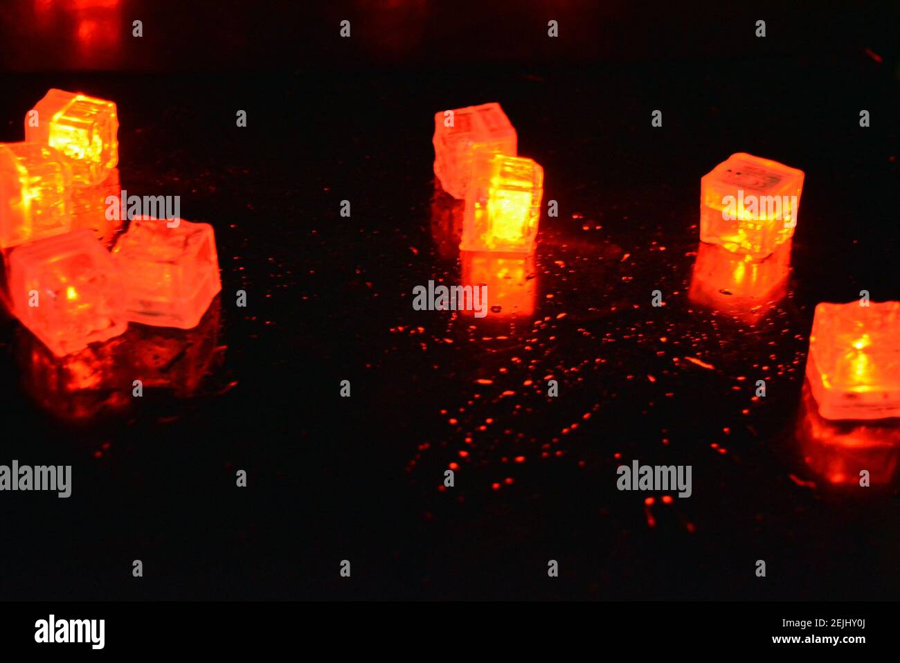 Very bright and not ordinary background of red glowing ice cubes ...