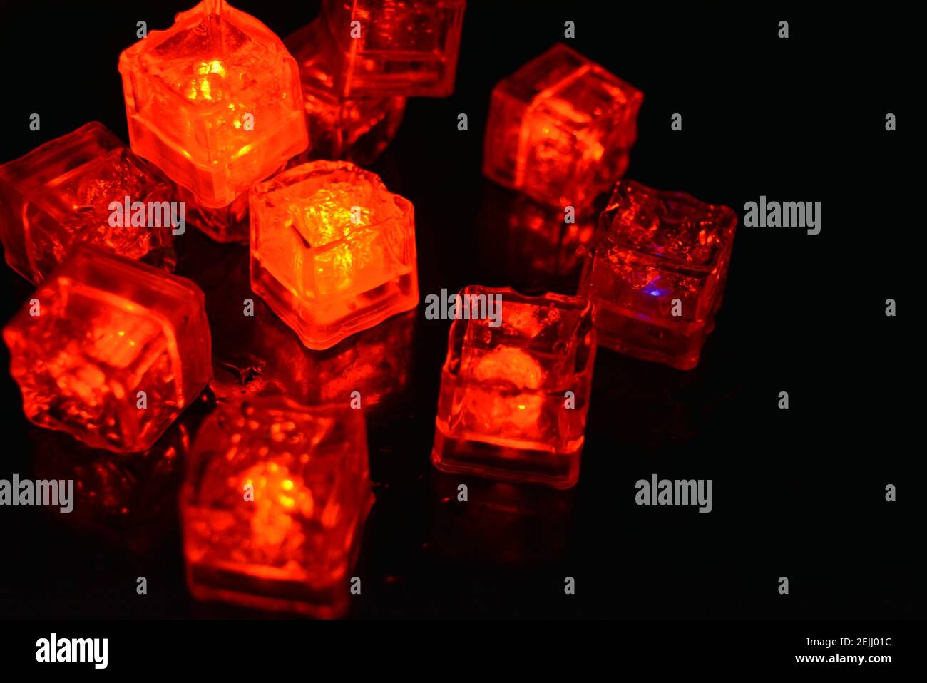 Very bright and not ordinary background of red glowing ice cubes ...