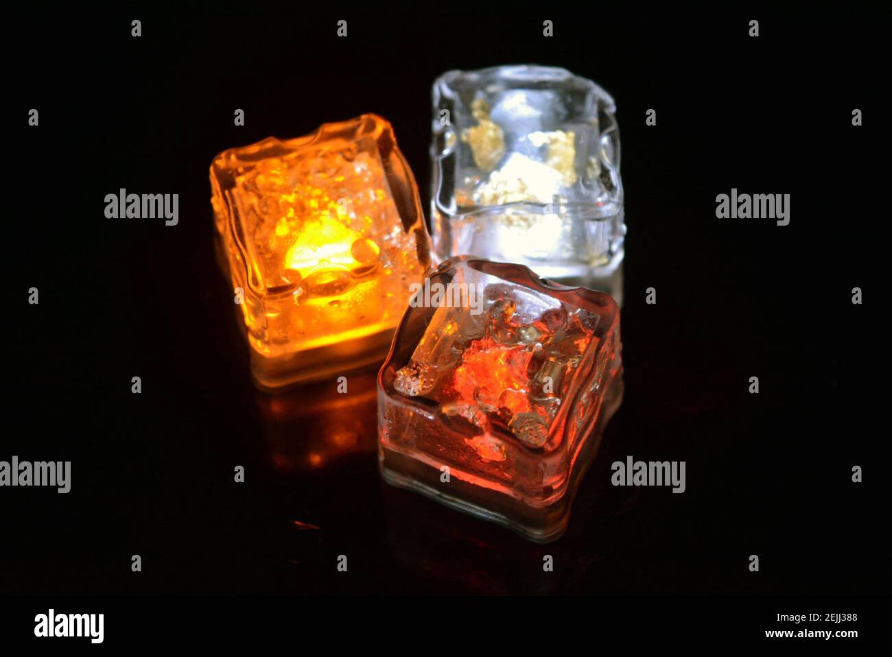 Beautiful plastic ice cubes with bright diode light. Red, yellow, white ...