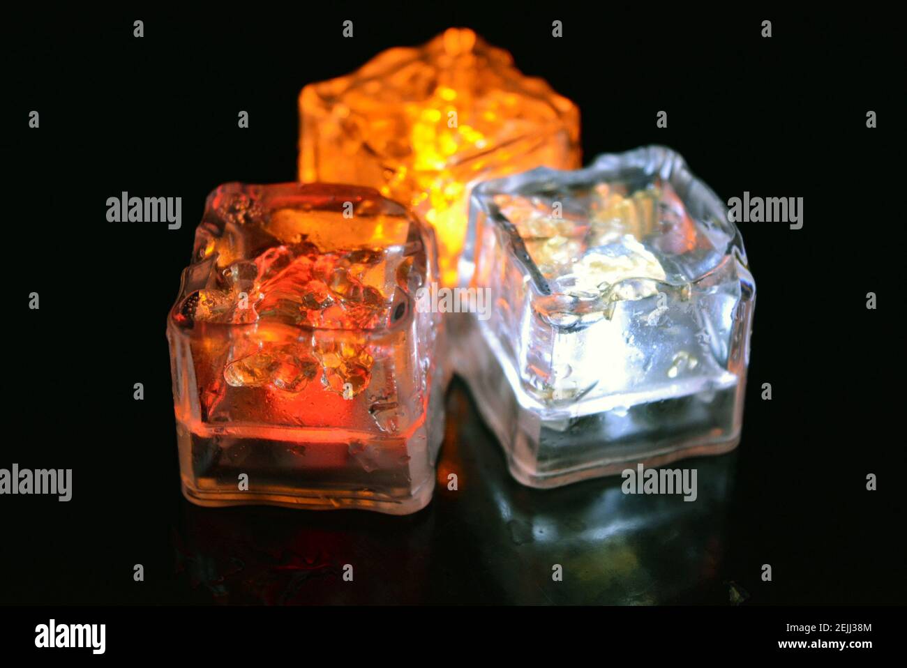 Beautiful plastic ice cubes with bright diode light. Red, yellow, white ...