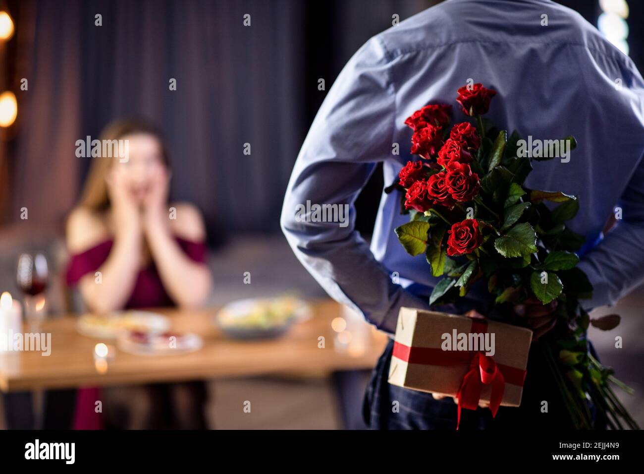 Romantic Black Guy Holding Flowers And Gift Behind Back, Surprising His ...