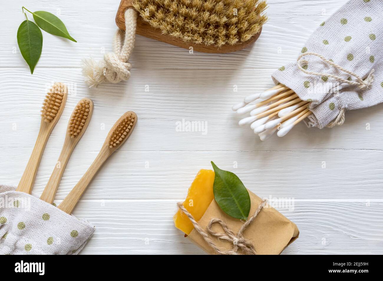 Eco-friendly personal care and home cleaning items on a white ...