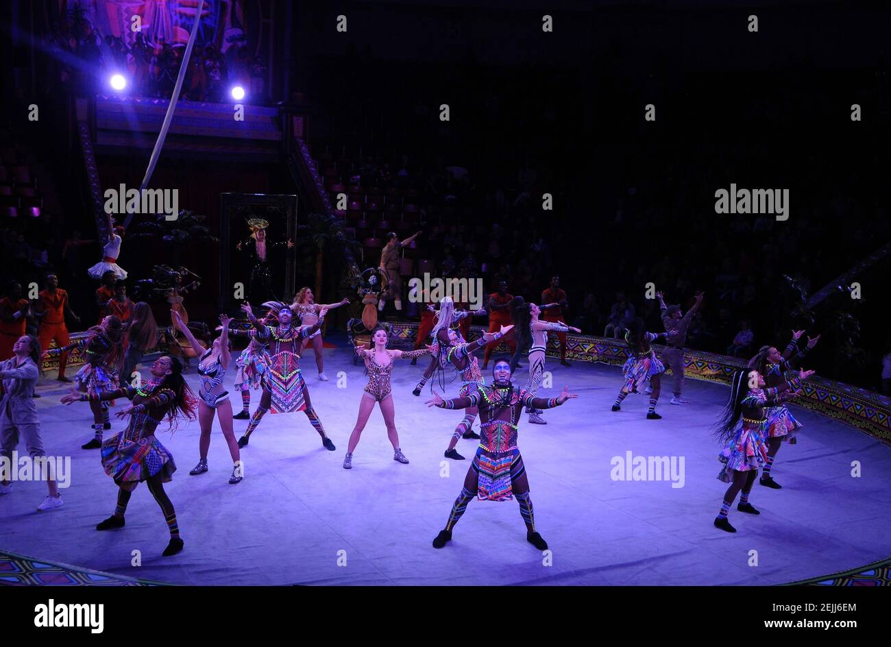 Artists dressed in traditional costumes perform during the grand ...