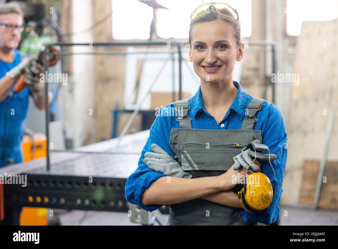Workers in a metal workshop Stock Photo - Alamy