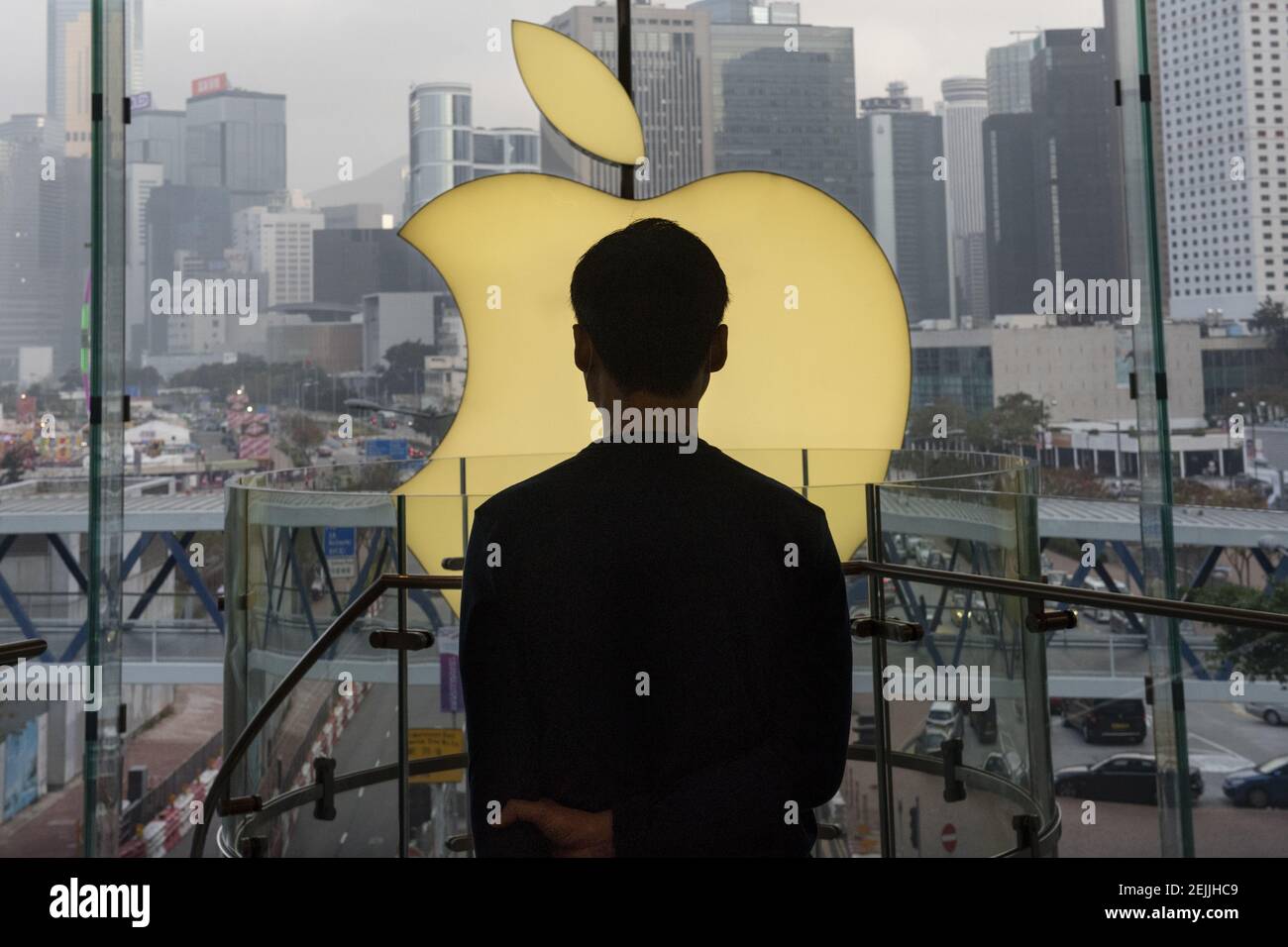 An employee stands in front of an American multinational technology ...