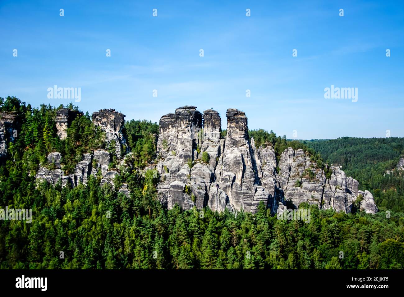 Breathtaking view of rocky cliffs surrounded by trees in the middle of ...