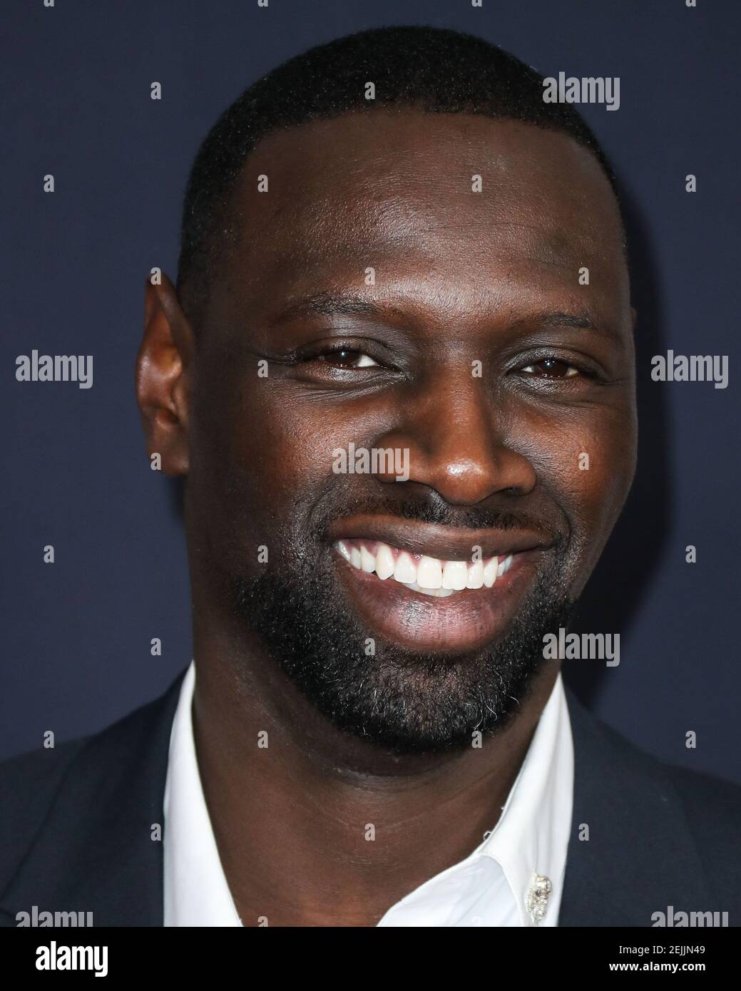 HOLLYWOOD, LOS ANGELES, CALIFORNIA, USA - FEBRUARY 13: Omar Sy arrives ...