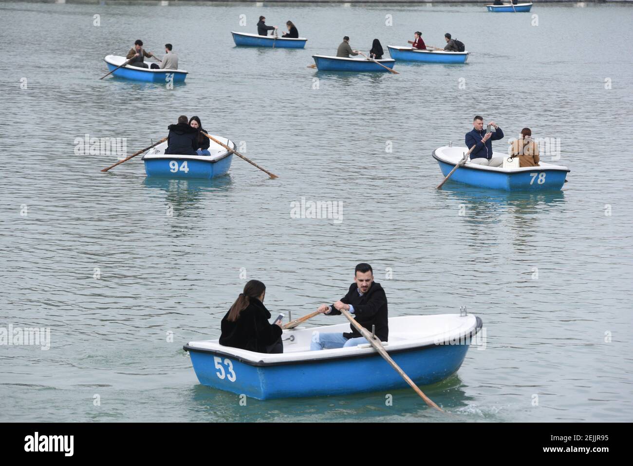 Couples row boats at the Retiro Park in Madrid during the Saint ...