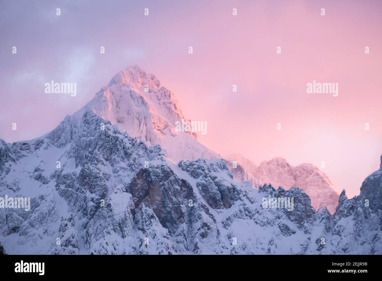 Beautiful close up shot of a pink glowing mountain tops in the Alps at ...