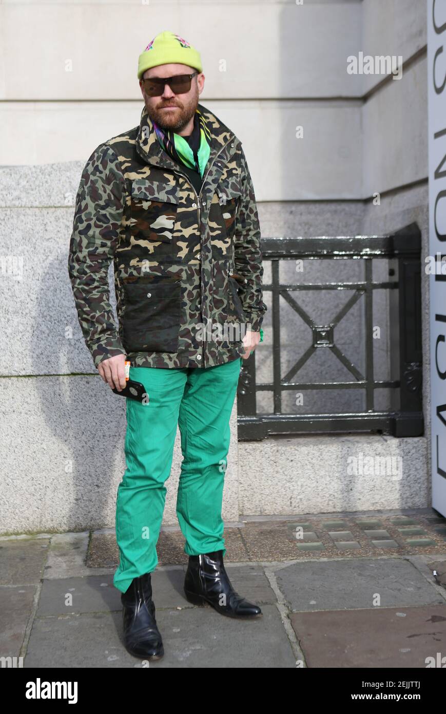 Stylish Fashion Enthusiast poses for a photo as he attends the London ...