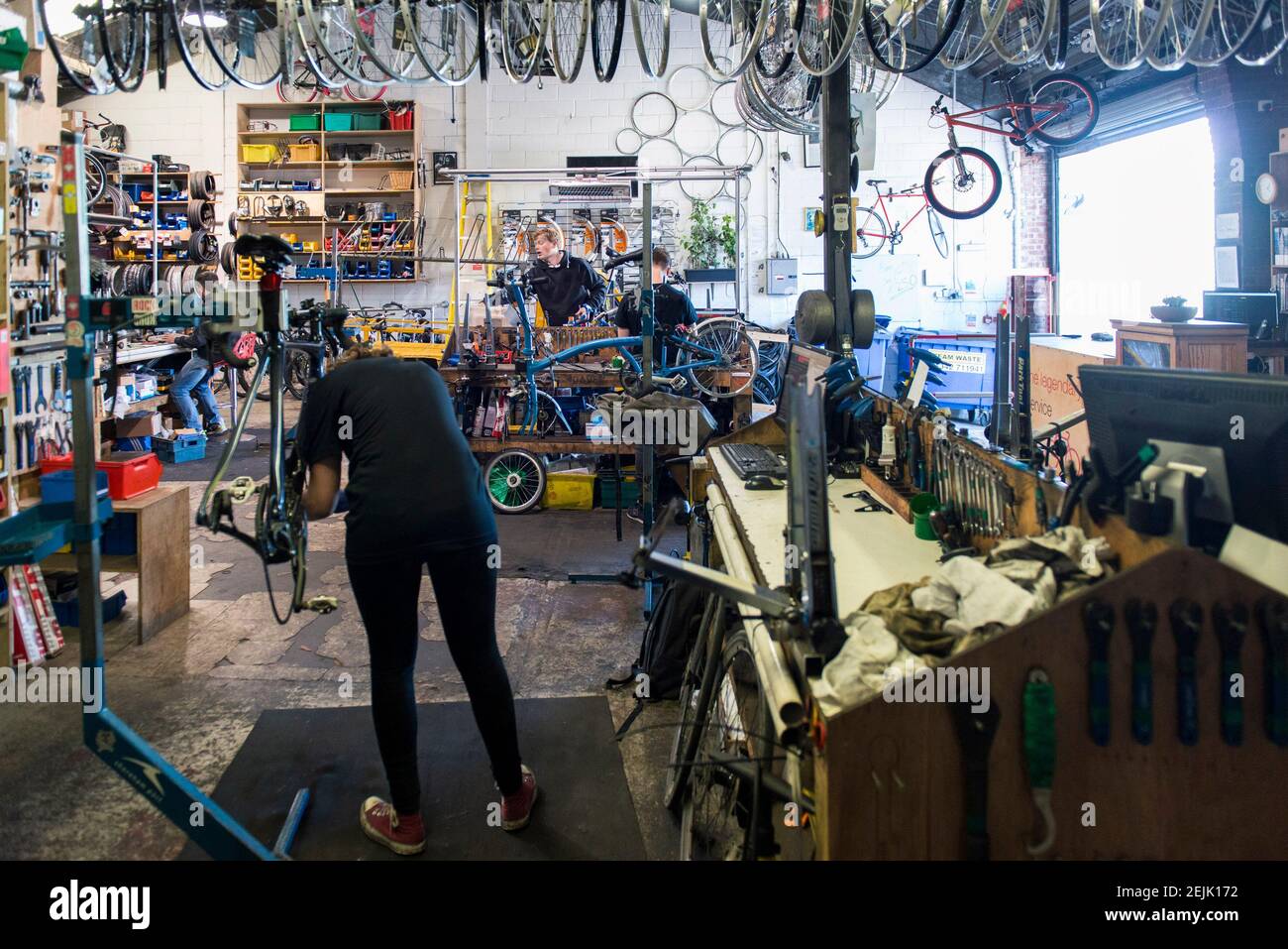 Mechanic works on bike hi-res stock photography and images - Alamy