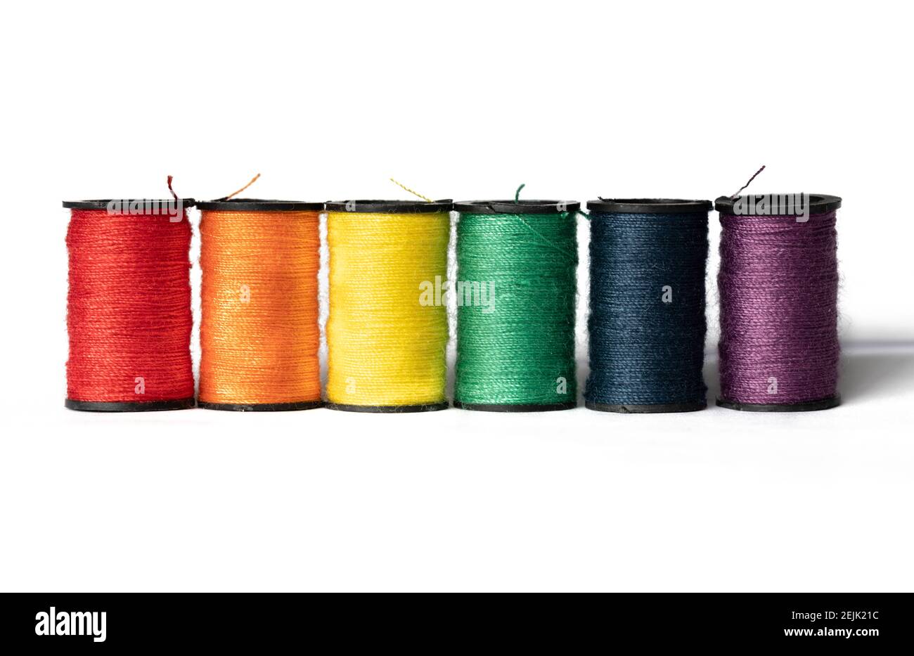 Spools of thread in colors of the rainbow on white background Stock ...