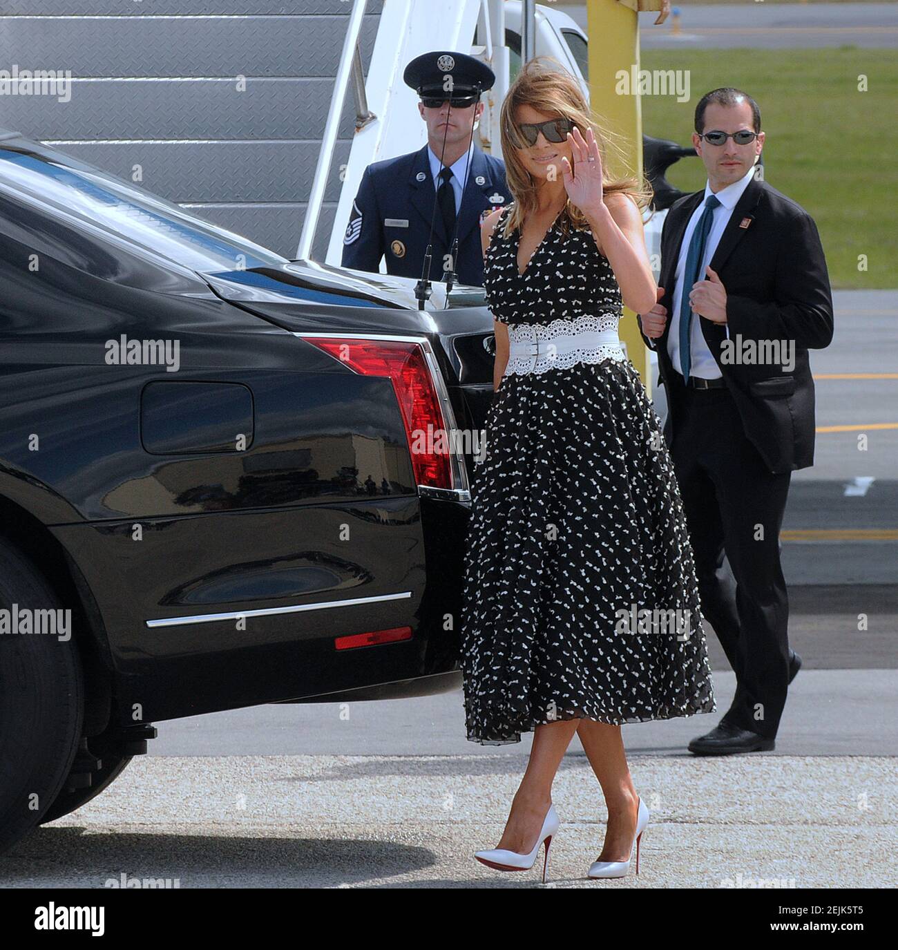 First Lady Melania Trump waves as she and U.S. President Donald Trump ...