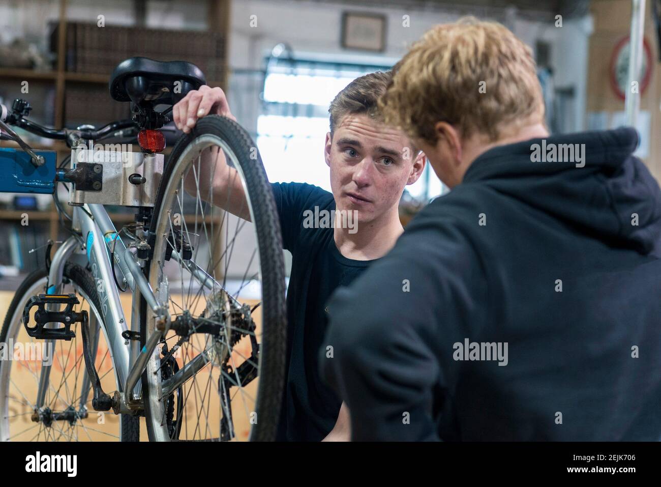 Fixing a bike hi-res stock photography and images - Alamy