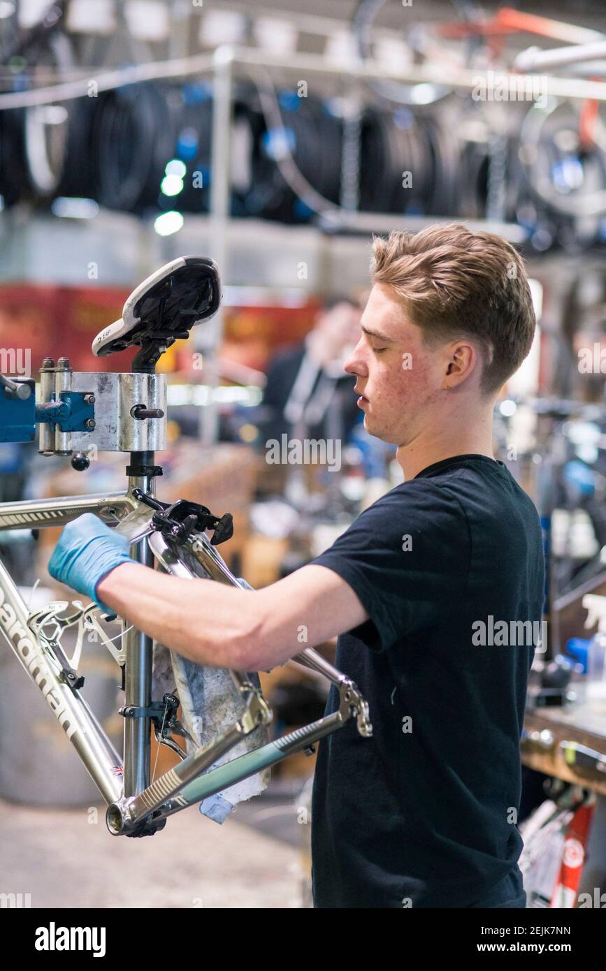Mechanic works on bike hi-res stock photography and images - Alamy