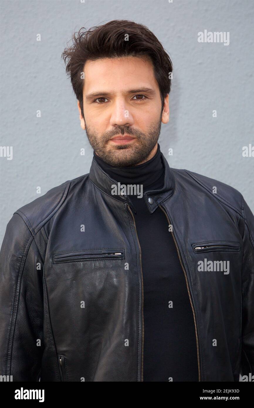 MIAMI, FL - FEB 16: Turkish actor Kaan Urgancioglu poses outside during ...