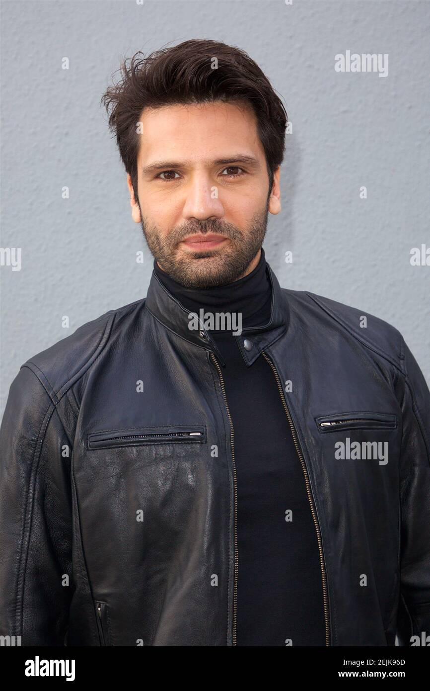 MIAMI, FL - FEB 16: Turkish actor Kaan Urgancioglu poses outside during ...
