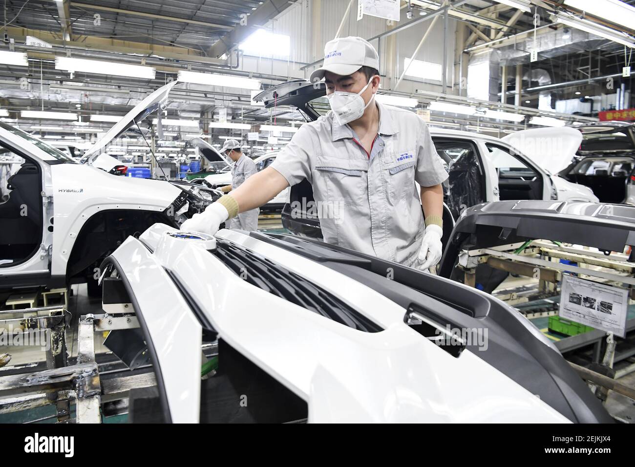 Chinese workers assemble Toyota SUVs on the assembly line at a plant of ...