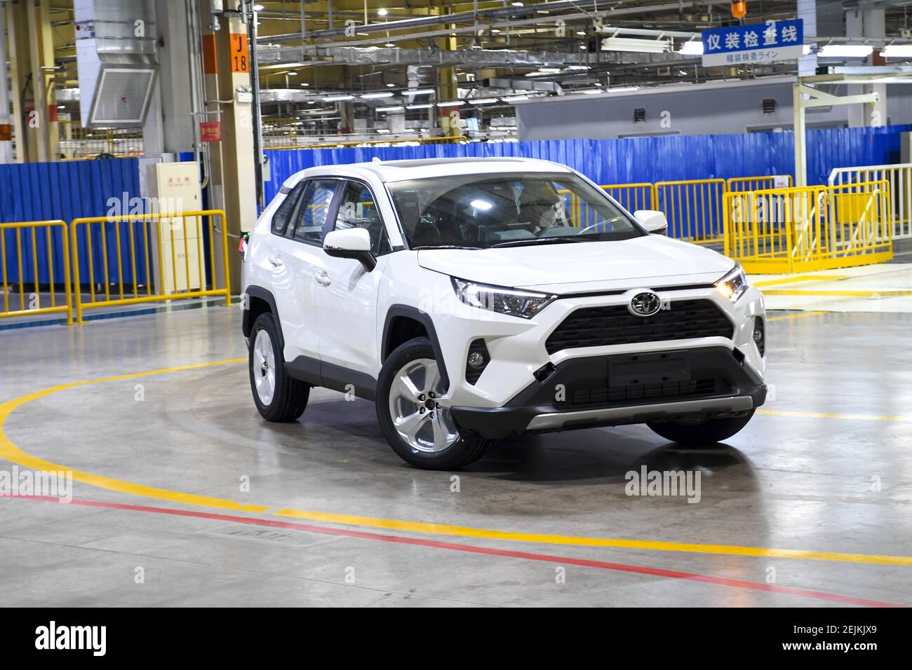 A Chinese worker tests a newly-manufactured Toyota SUV at a plant of ...