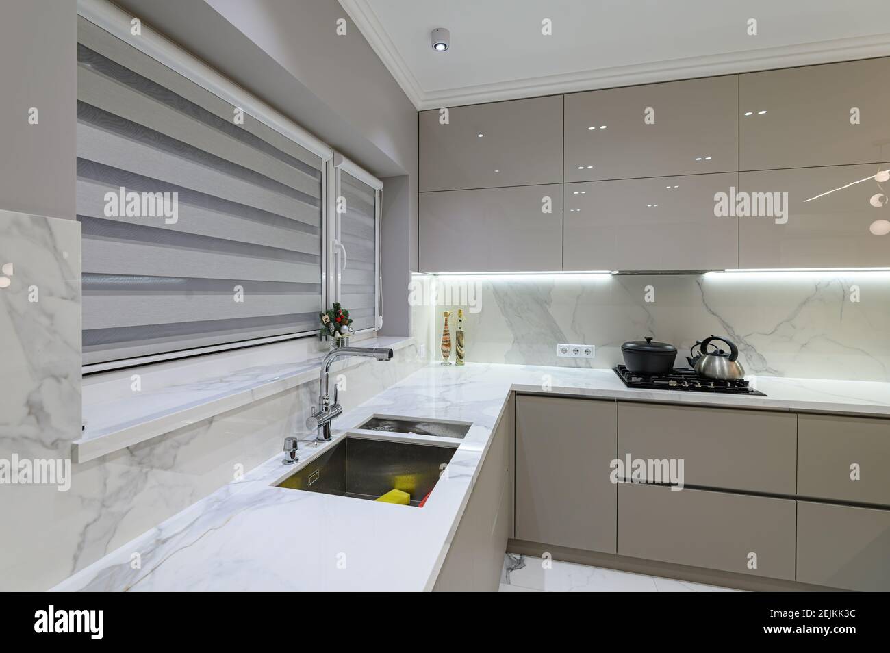 Luxury white modern marble kitchen in studio space Stock Photo - Alamy
