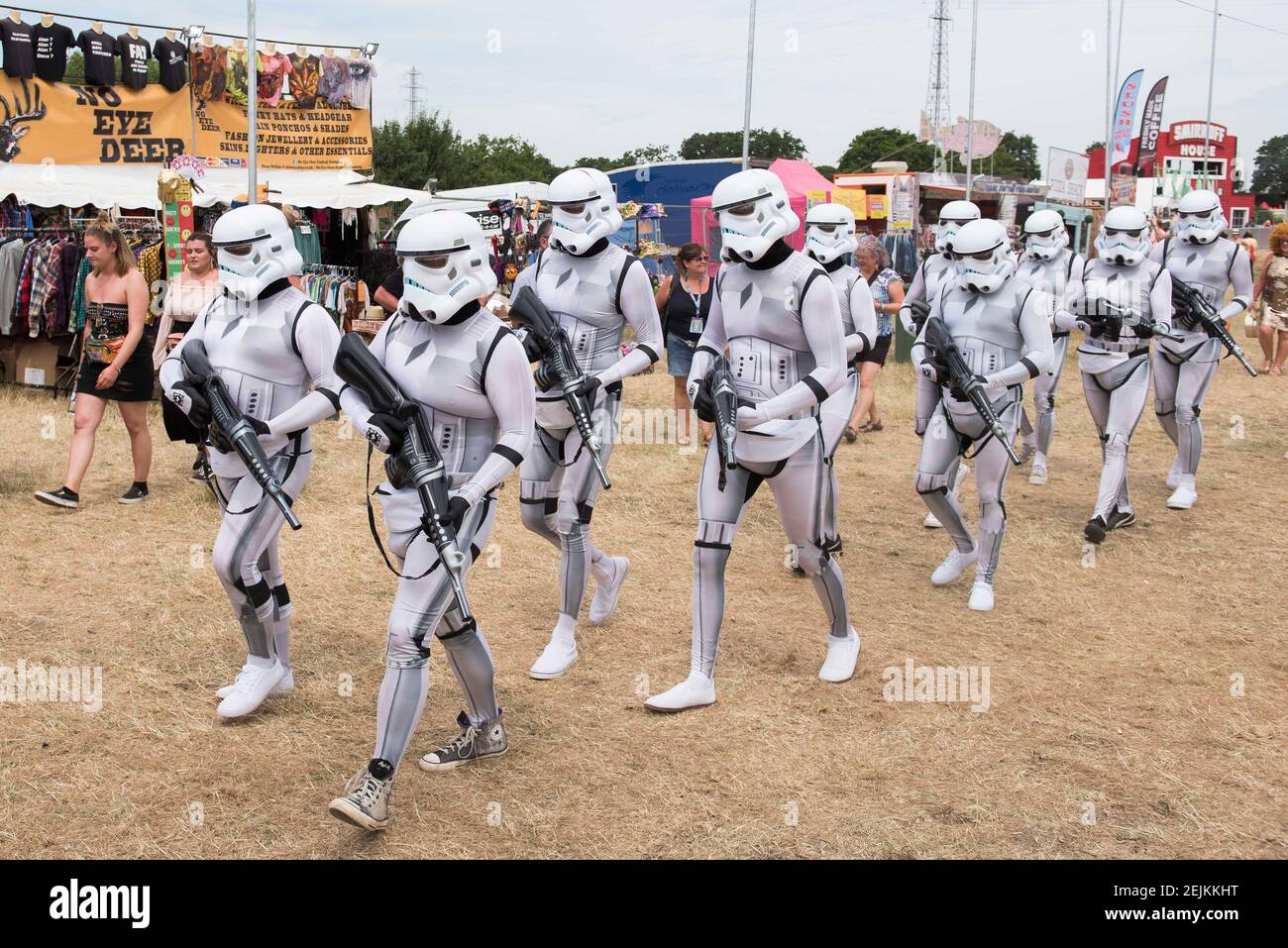 Festival goers in Star Wars storm trooper fancy dress walk across site ...