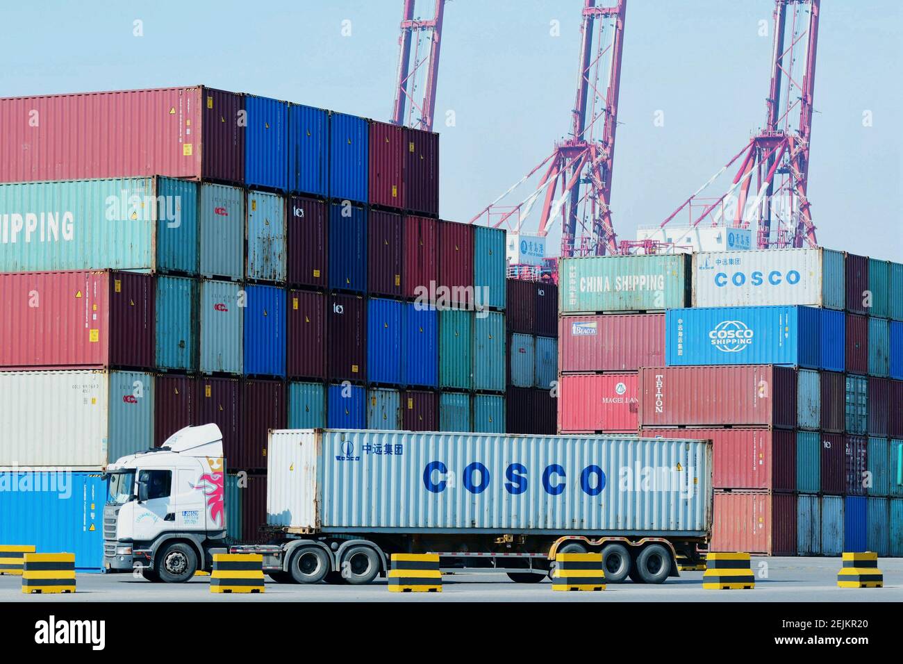 A truck transport a container of COSCO in a terminal at the Port of ...