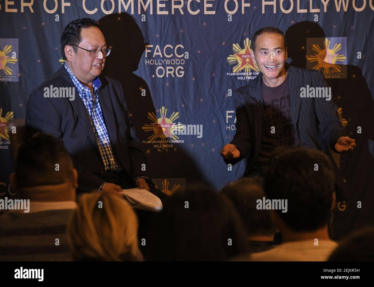 Moderator Ted Benito and Mark Dacascos speaking at the Filipino ...