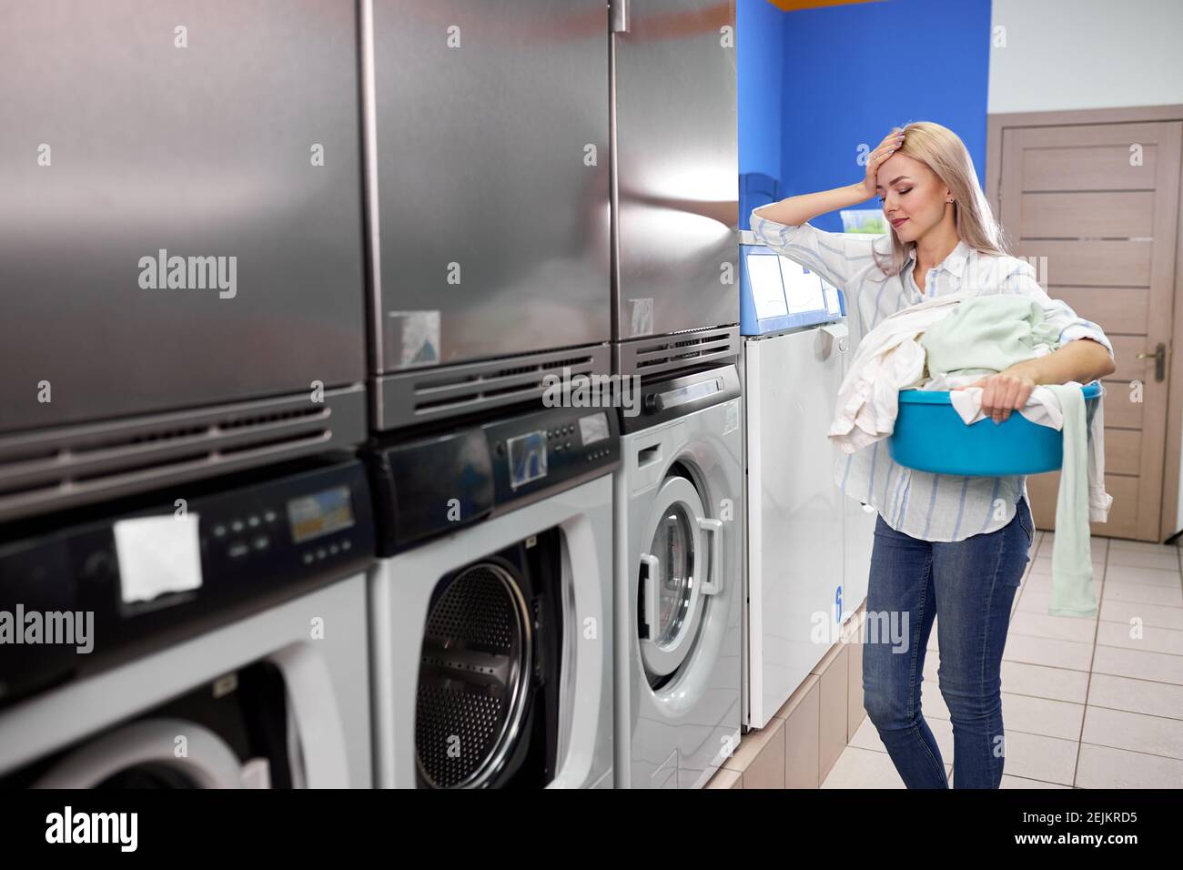 woman doing laundry, looking sad and depressed expression, having bad ...