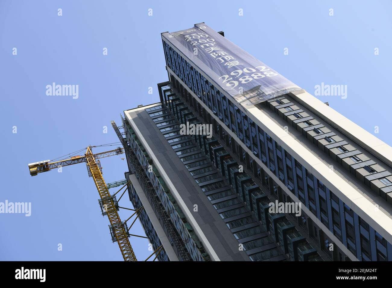 In this unlocated and unlocated photo, apartment buildings are under ...