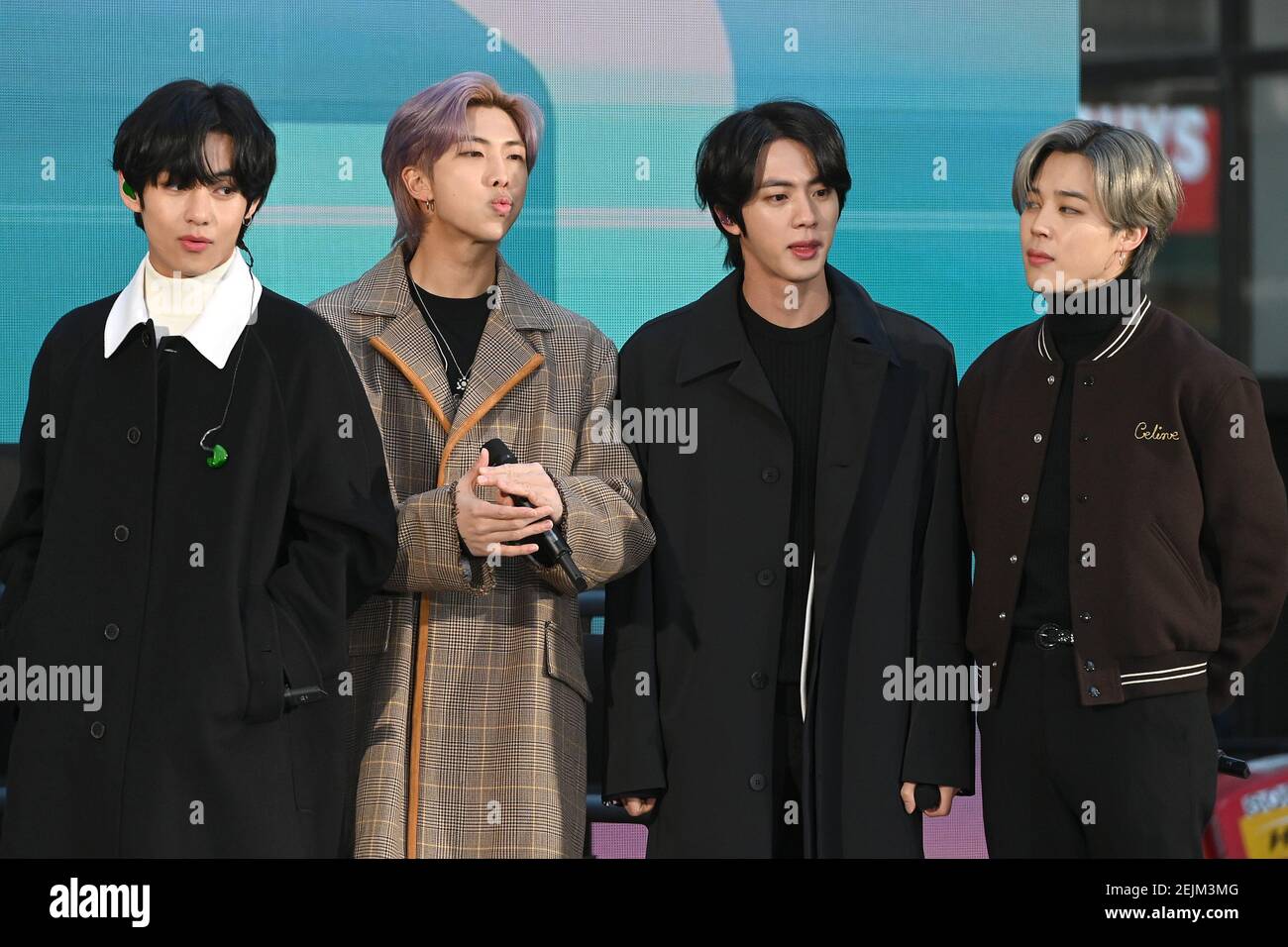 Members of the K-pop band BTS are seen on stage during a live interview ...