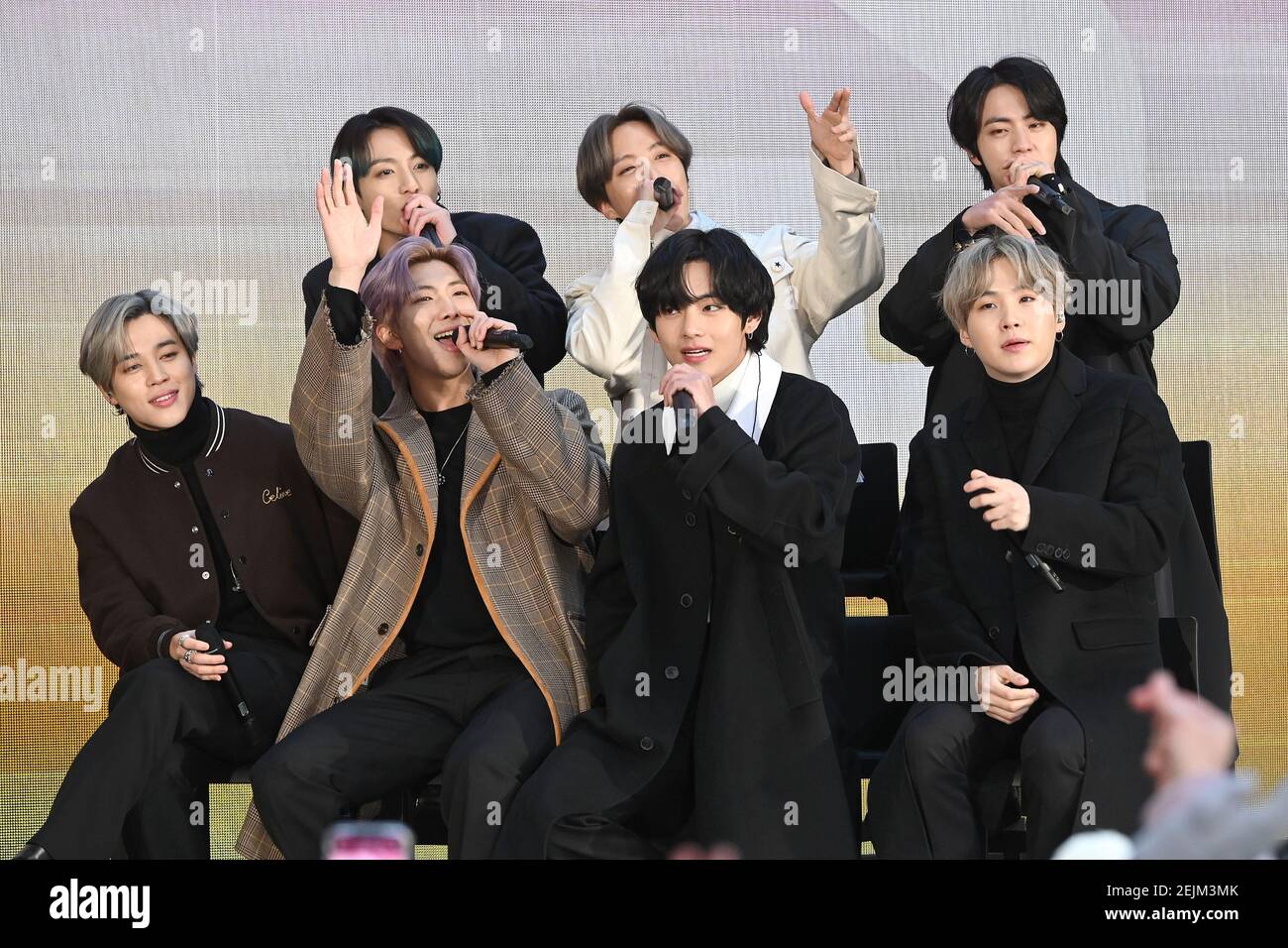 Members of the K-pop band BTS are seen on stage during a live interview ...