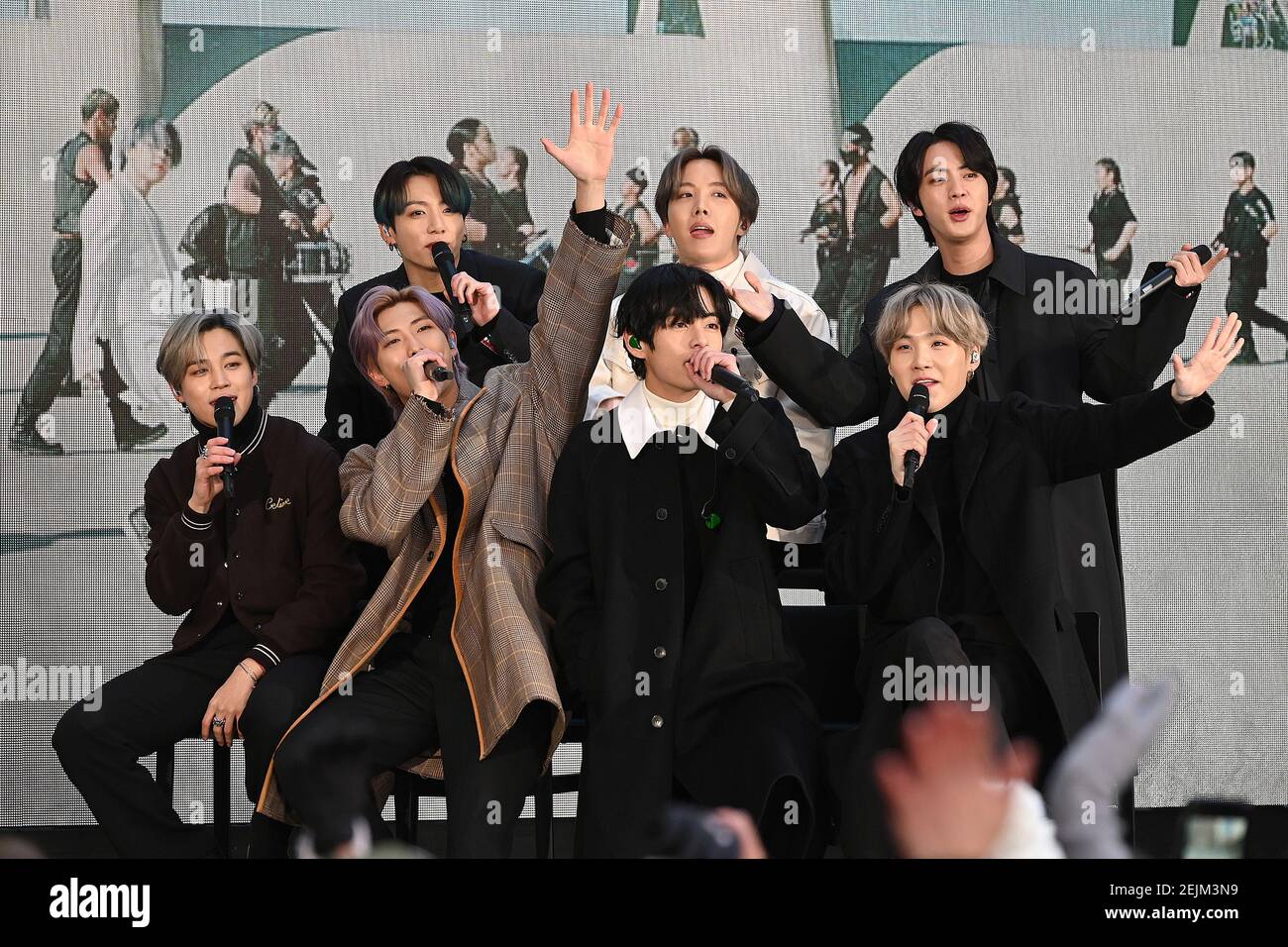 Members of the K-pop band BTS are seen on stage during a live interview ...