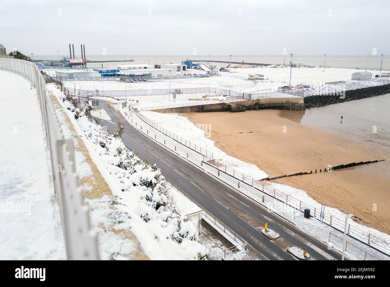 Ramsgate, UK - Feb 8 2021 Snow on the beach and covering the port of ...