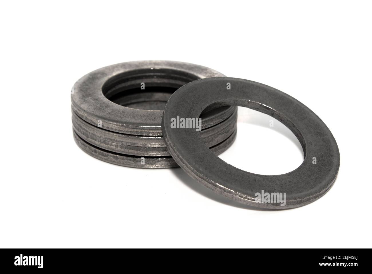 A few big industrial galvanized steel washers on white background Stock ...