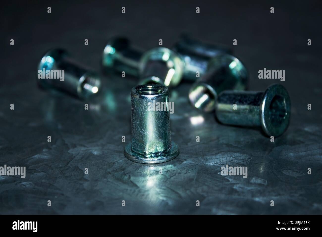 A few industrial blind rivets on a galvanized metal sheet Stock Photo ...