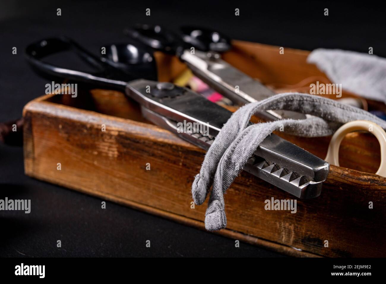 Scissors on the table in the tailor's workshop. Accessories necessary ...