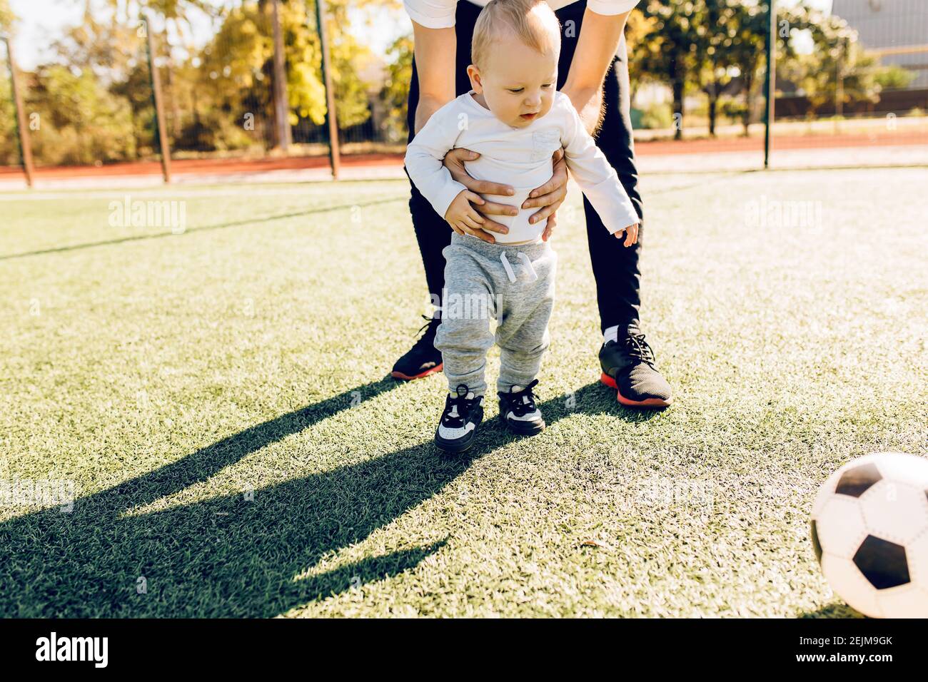 Mom child football game hi-res stock photography and images - Alamy