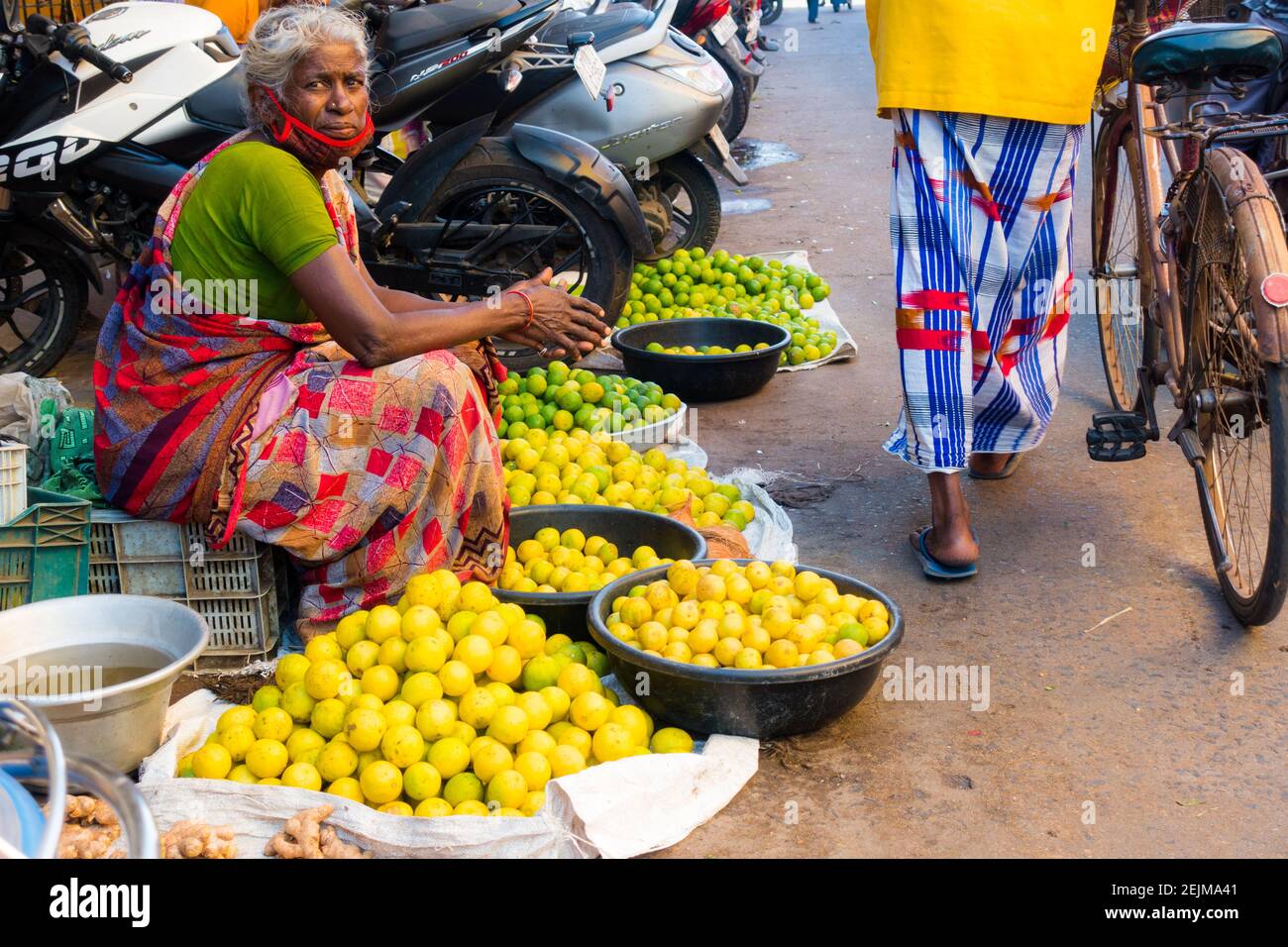 Woman selling lemons on the streets of Pondicherry, India Stock Photo ...