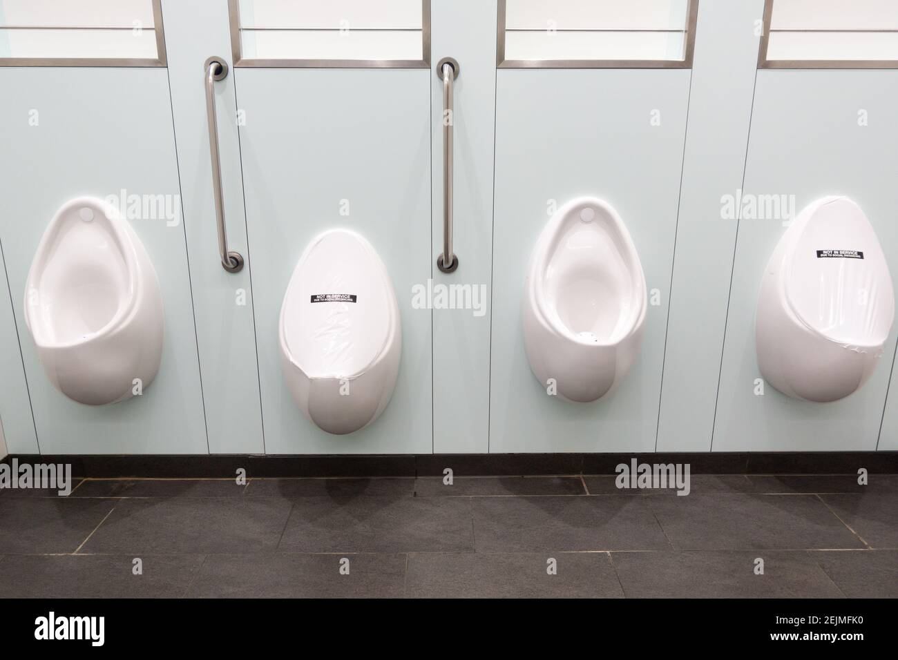 Social distancing in Mens toilet Stock Photo - Alamy