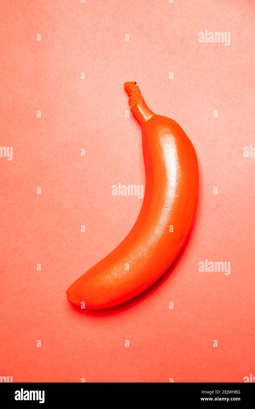 Banana on red surface hi-res stock photography and images - Alamy