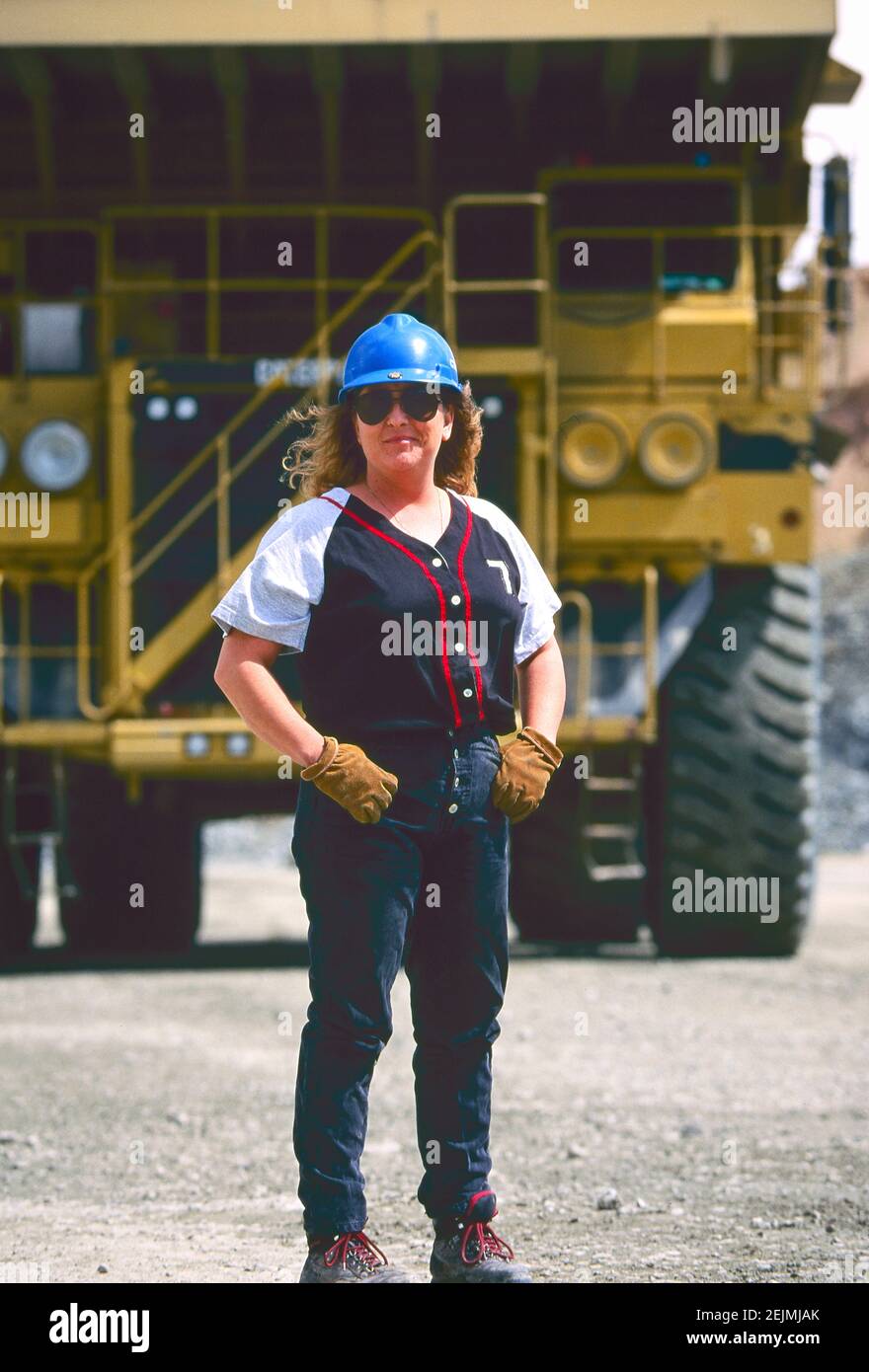 A female giant dump truck operator at an open pit copper mine in ...