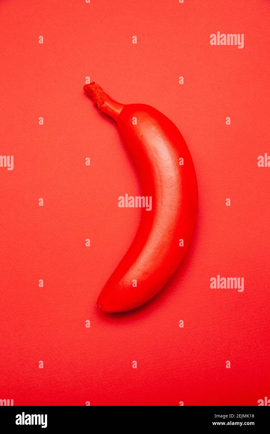 Red colored tropical banana on bright surface Stock Photo - Alamy
