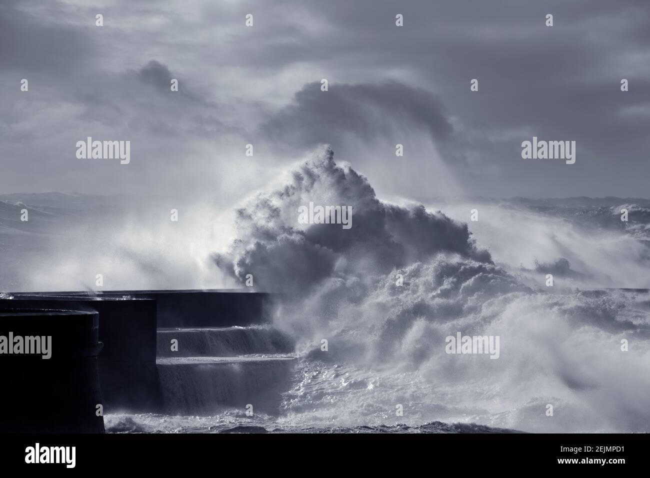 Stormy wave splash. Enhanced sky. Converted black and white. Toned blue ...